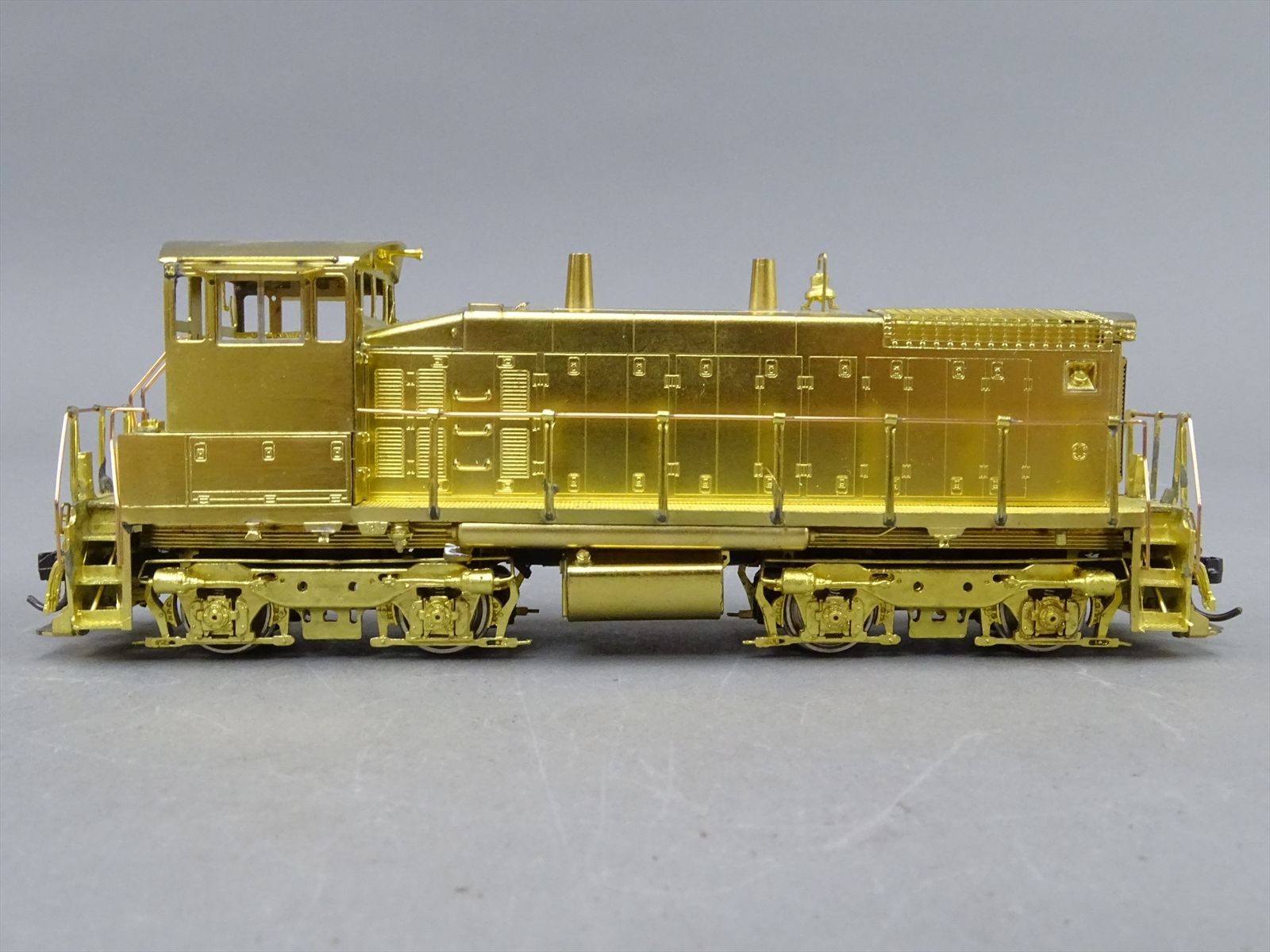 HO Brass Model - OMI 5072 EMD SW-1500 Flexi-Coil Trucks Full Railing - Unpainted - 1987 Run - Ajin